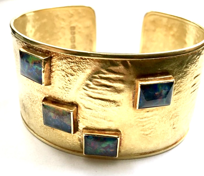 GERALD BENNEY 18CT GOLD AND OPAL BANGLE