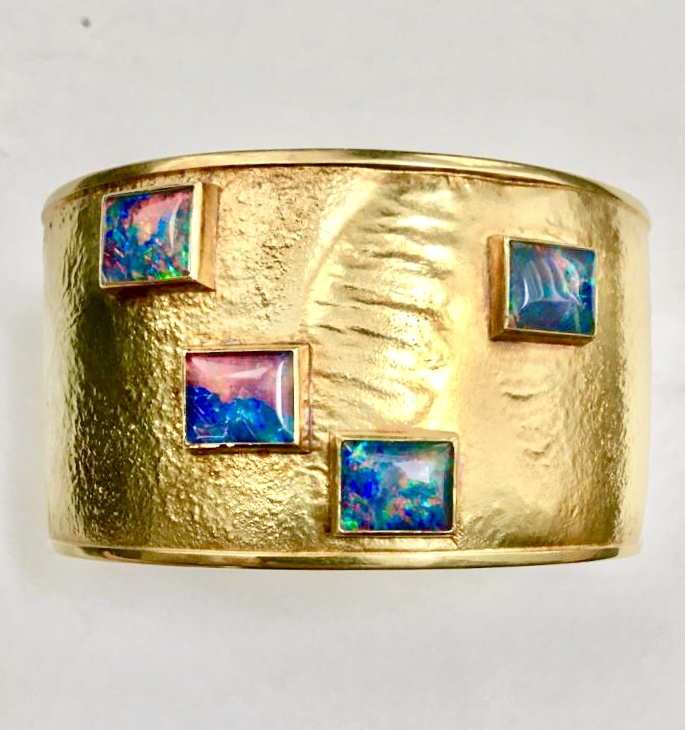 GERALD BENNEY 18CT GOLD AND OPAL BANGLE