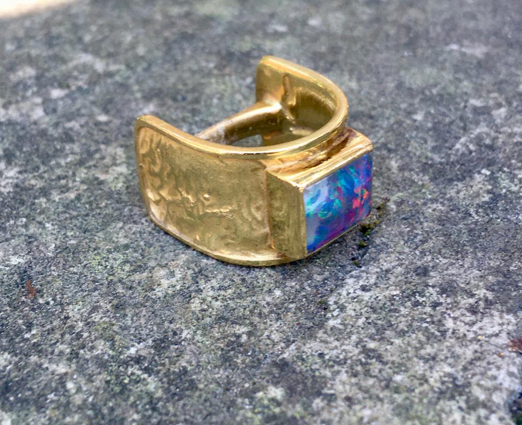 GERALD BENNEY 18CT GOLD AND OPAL RING,SIGNED,dated 1975